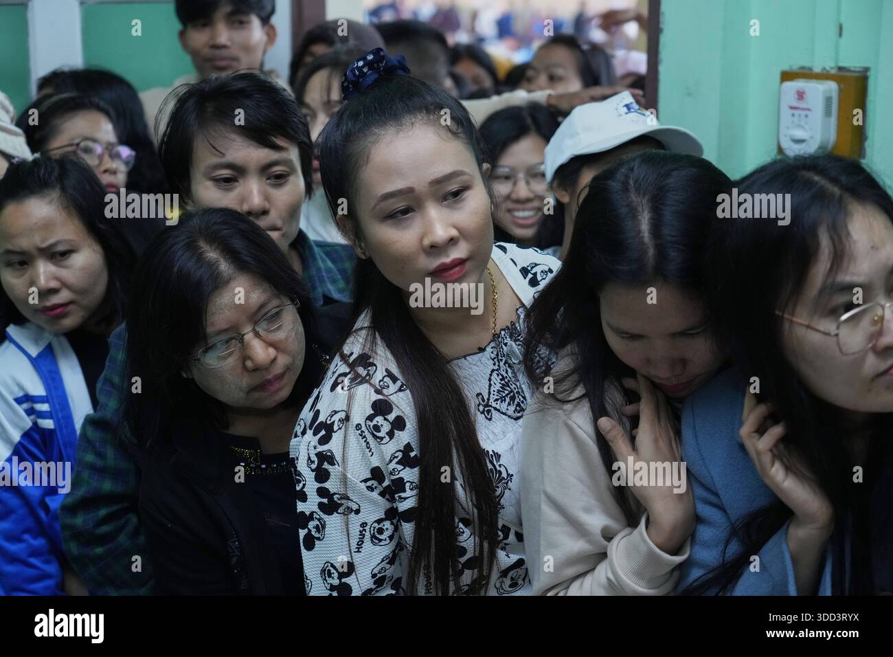 Voters line up to cast their ballots at a polling station in Naypyitaw ...