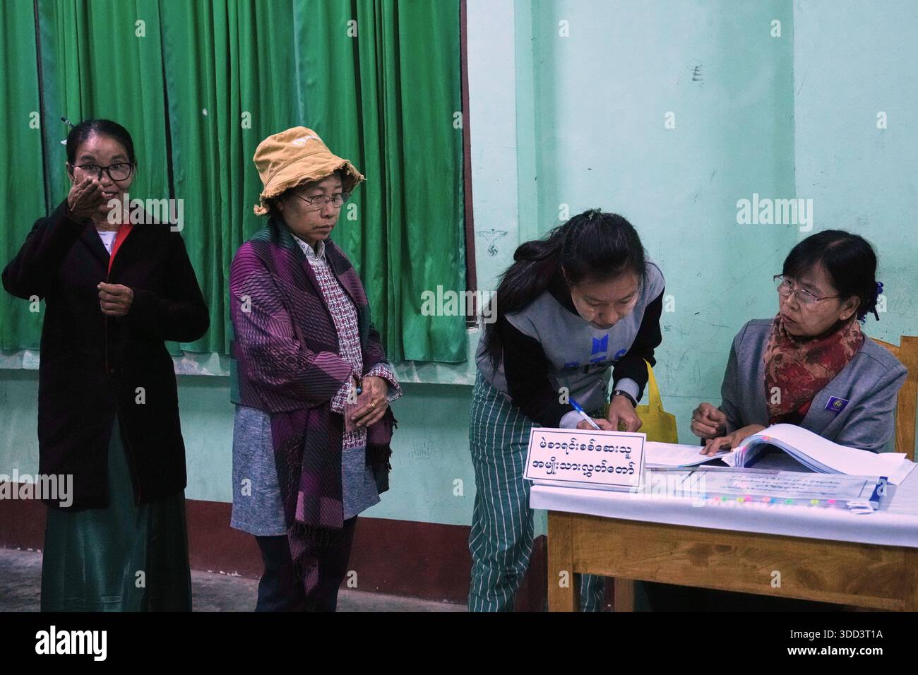 Voters register at a polling station in Naypyitaw, Myanmar, Sunday, Dec ...