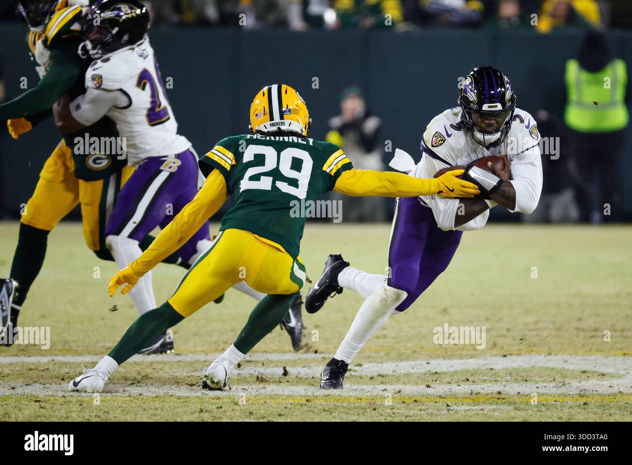Baltimore Ravens quarterback Tyler Huntley, right, runs past Green Bay ...