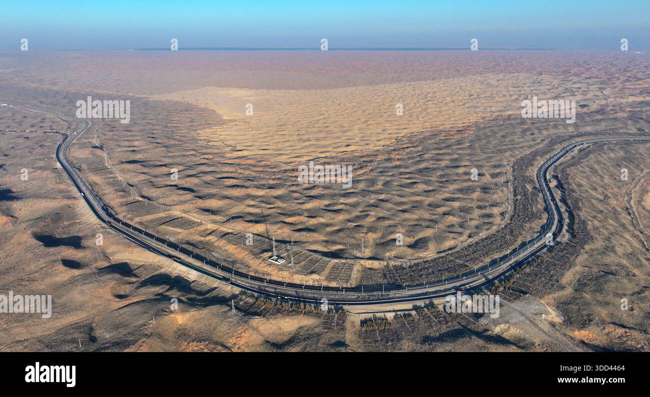 ZHONGWEI, CHINA - DECEMBER 27, 2025 - A train loaded with goods on the ...