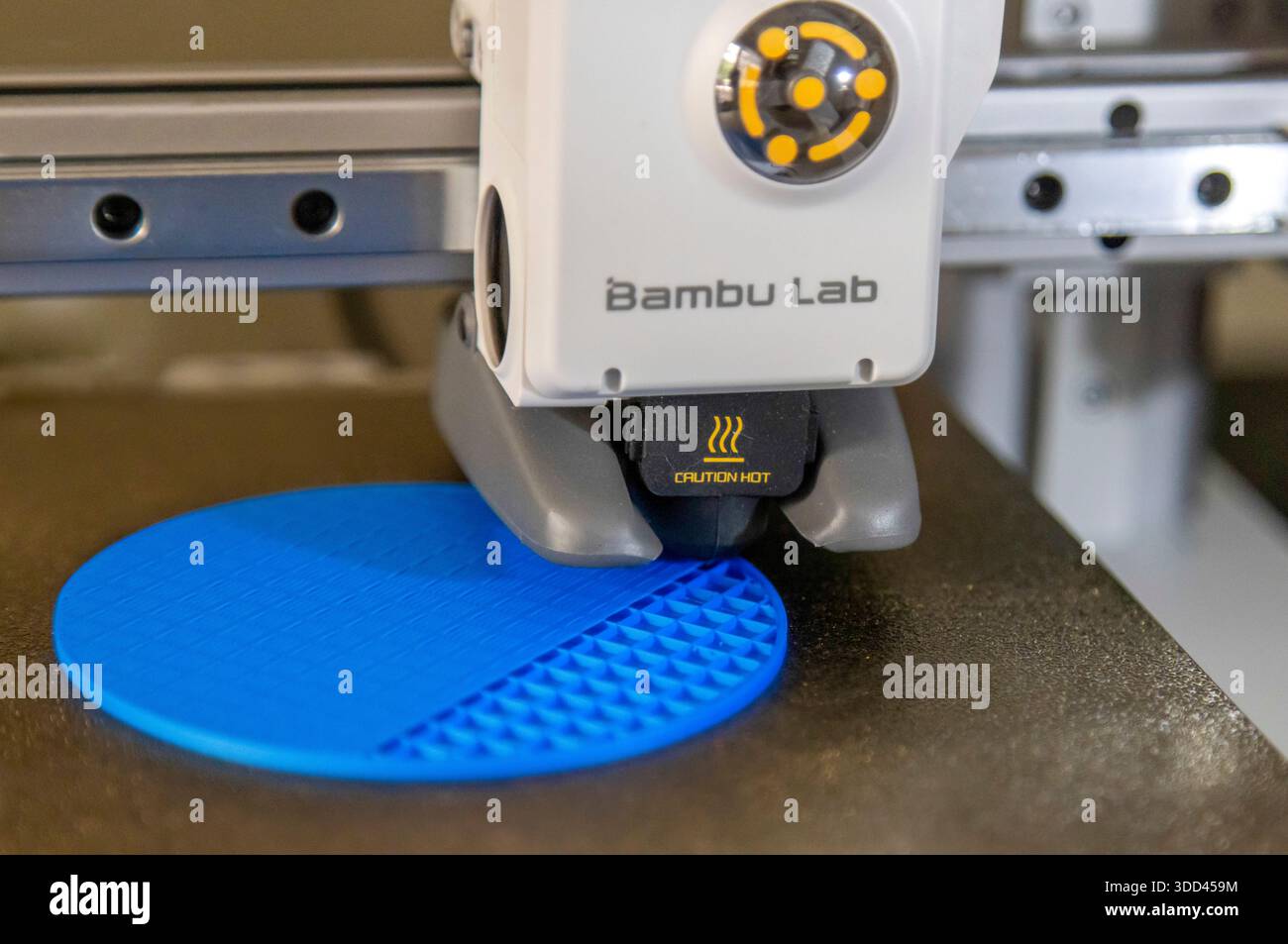 3D Printer printing a flat circular disk which forms the base for an ...