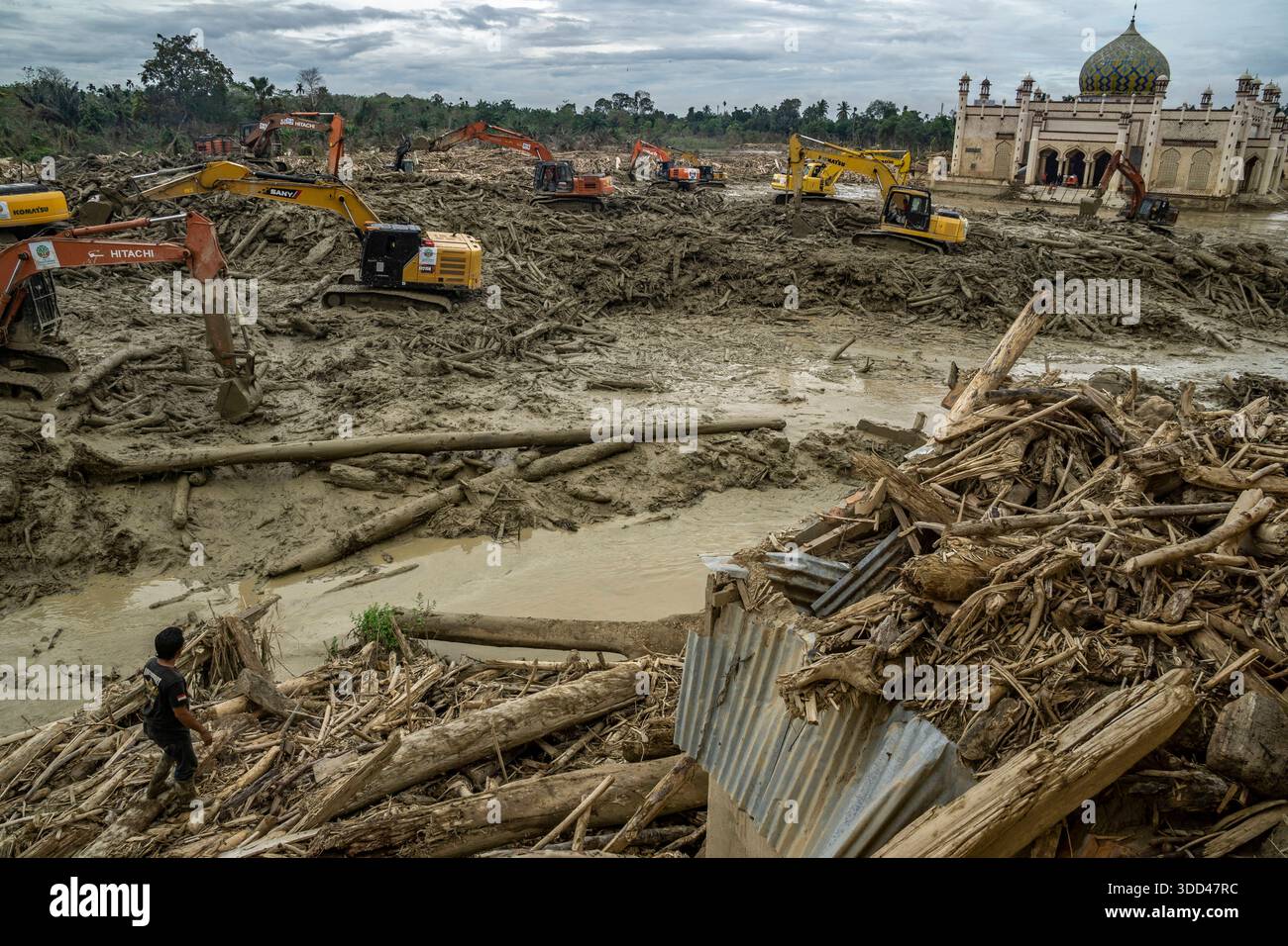 Heavy machinery clears massive logs at Darul Mukhlisin Islamic Boarding ...