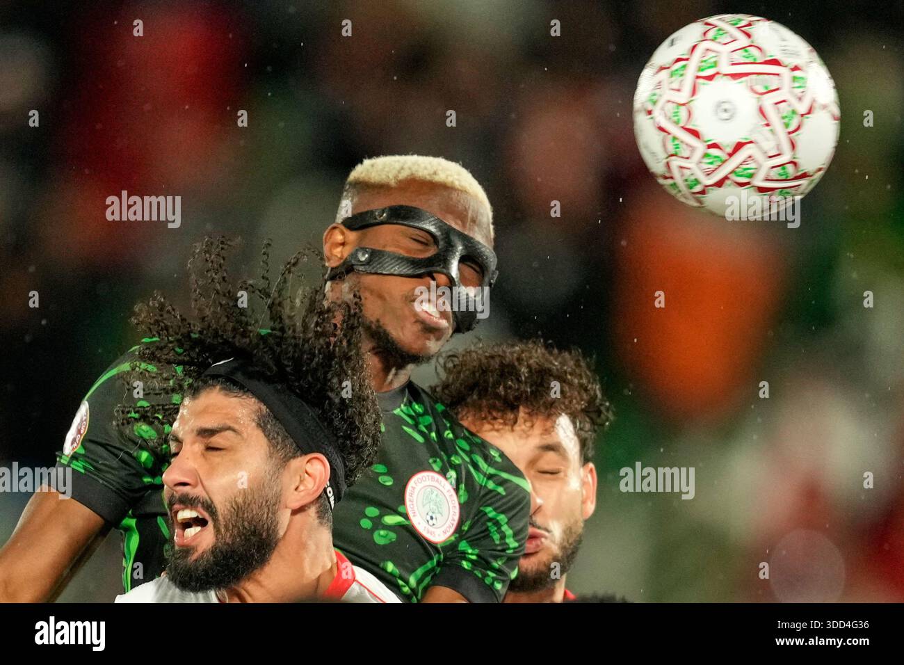 Nigeria's Victor Osimhen, center, heads the ball during the Africa Cup ...