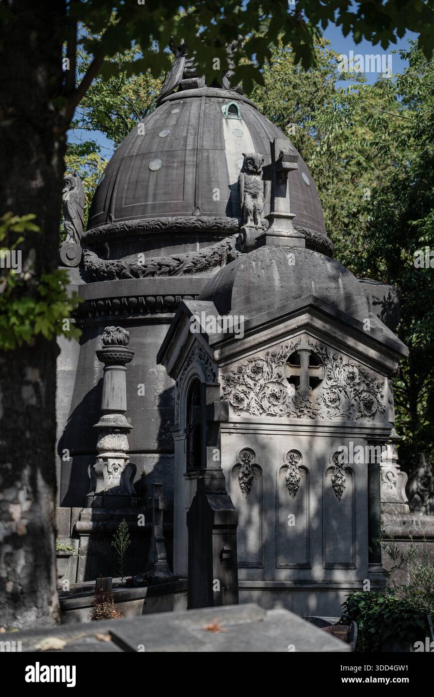 Large gravestones and mausoleums within a large cemetery. Large tombs ...