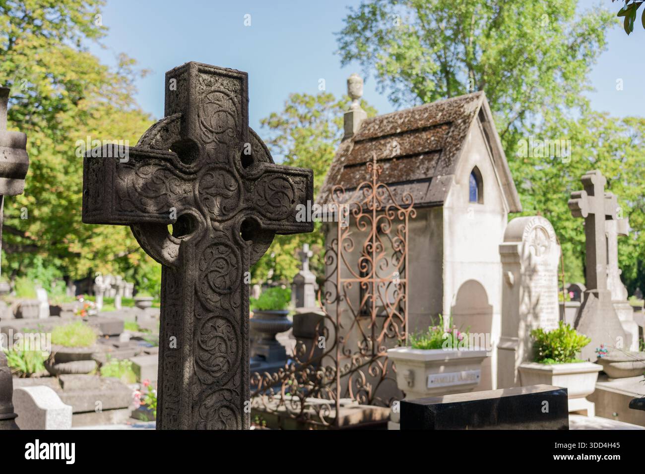 Large gravestones and mausoleums within a large cemetery. Large tombs ...