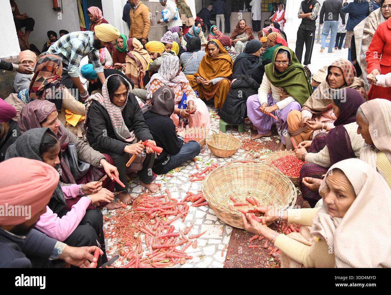 PATNA, INDIA - DECEMBER 27: Sikh community people preparing food during ...