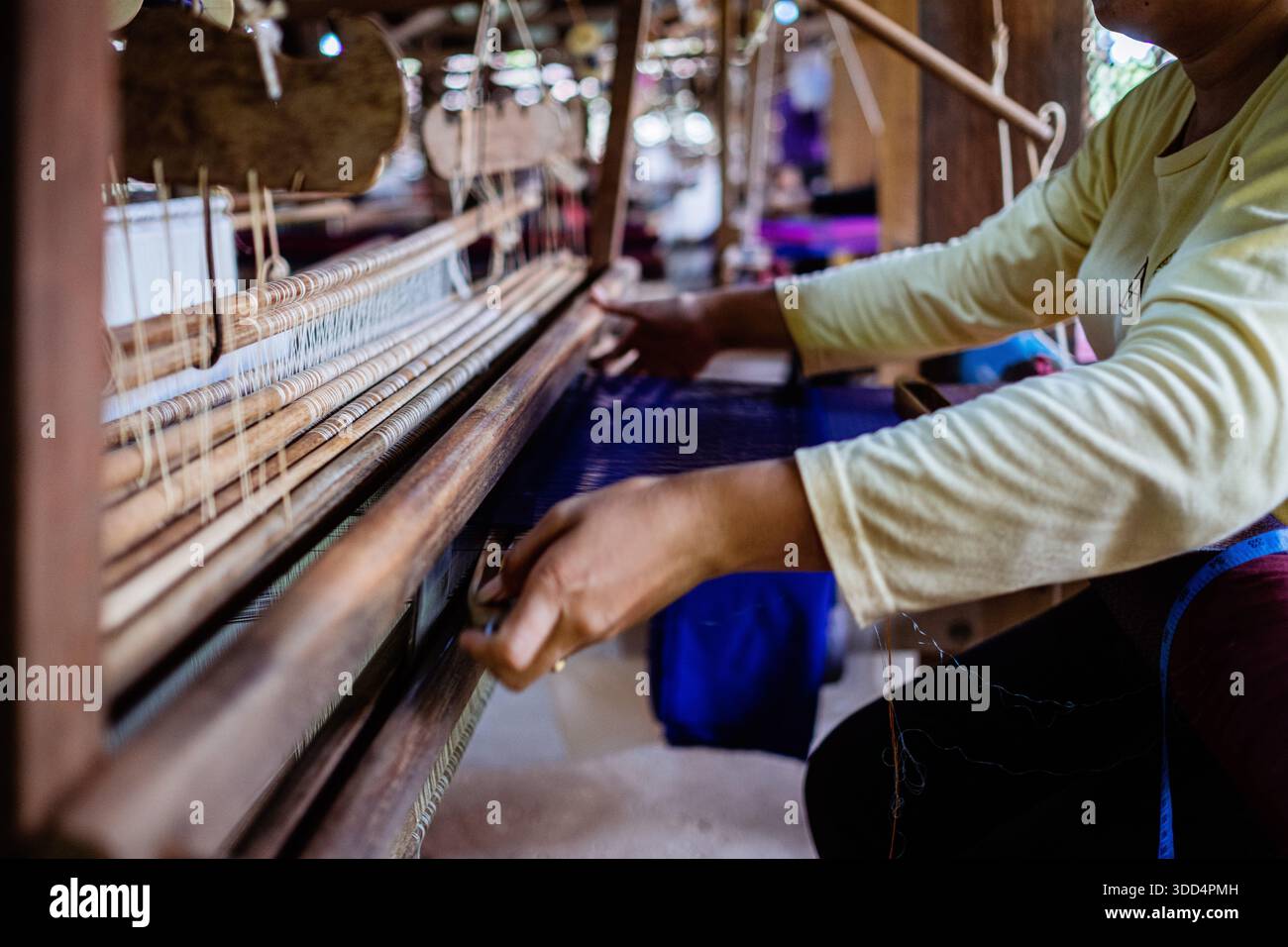 The silk threads are woven on traditional wooden looms. - 25/08/2025 ...