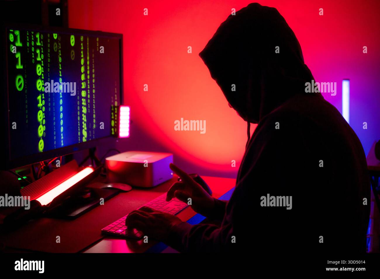 An expert hacker is decrypting data while hiding their face || Model ...