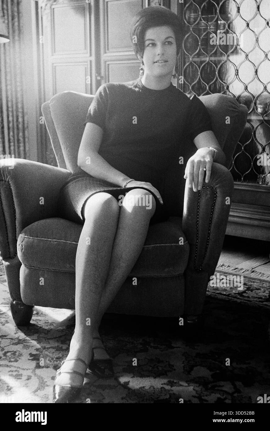 Attractive woman in white sweater Black and White Stock Photos & Images ...