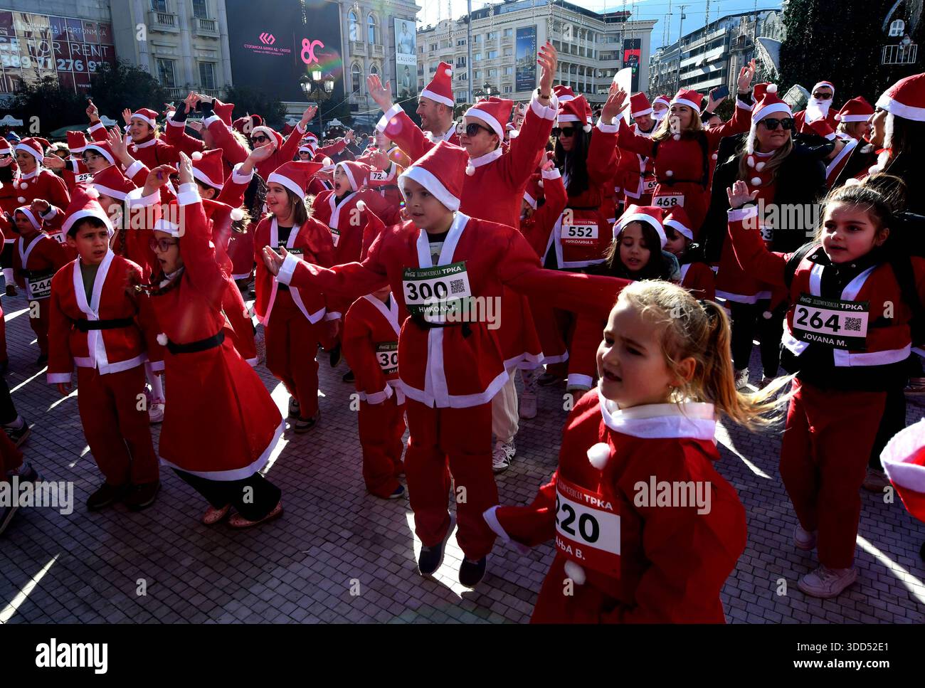 Participants dressed as Santa Clauses run during the traditional Santa ...