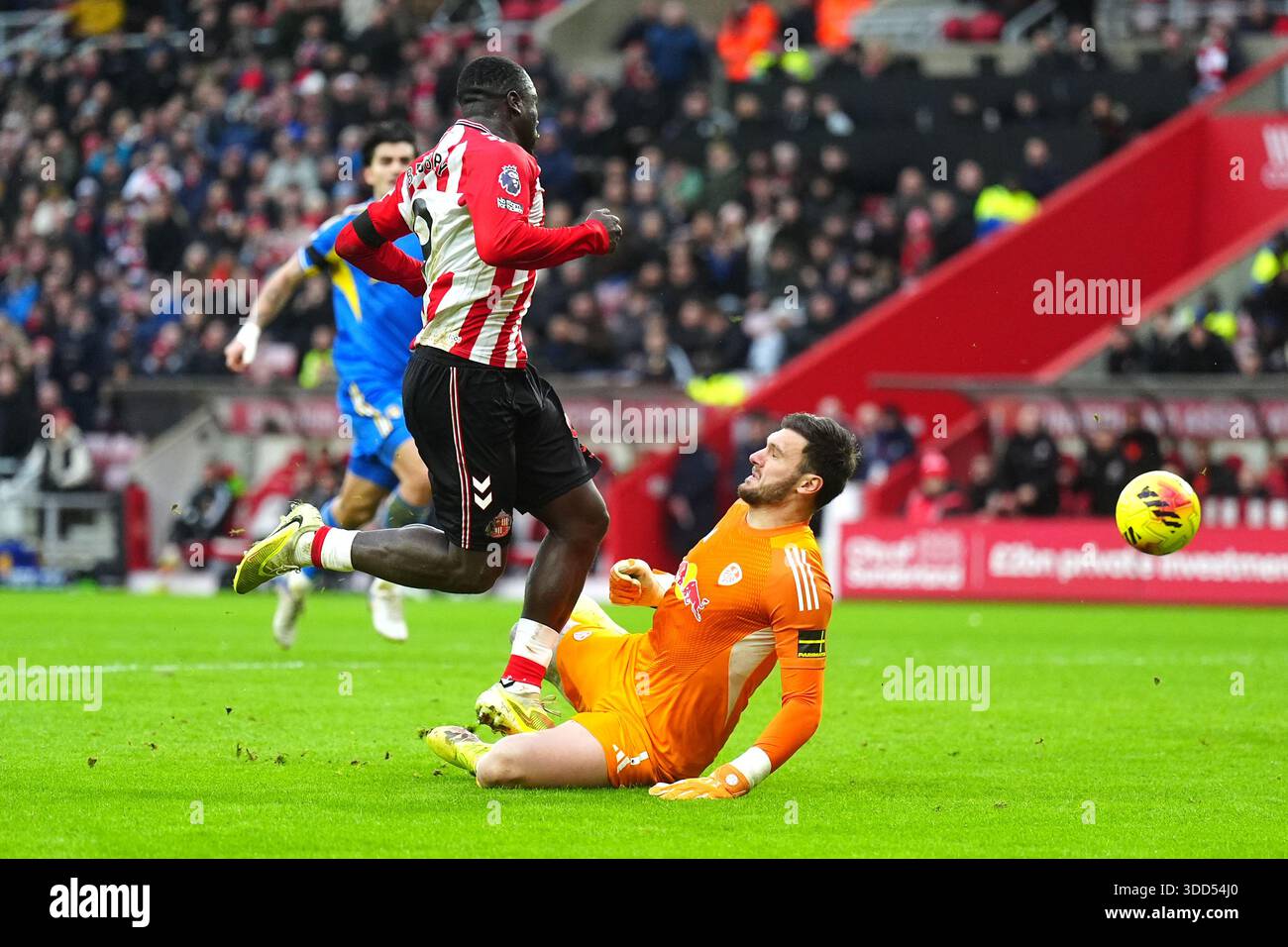 Sunderland's Brian Brobbey (left) shoots towards goal, which is saved ...