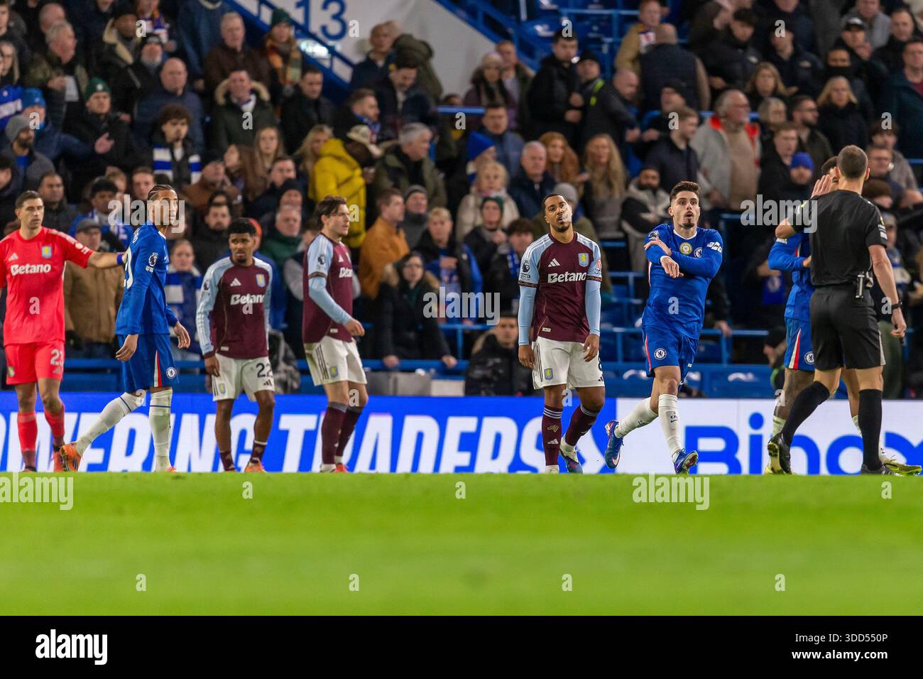 Pedro Neto of Chelsea reacts to Referee Stuart Attwell during the ...