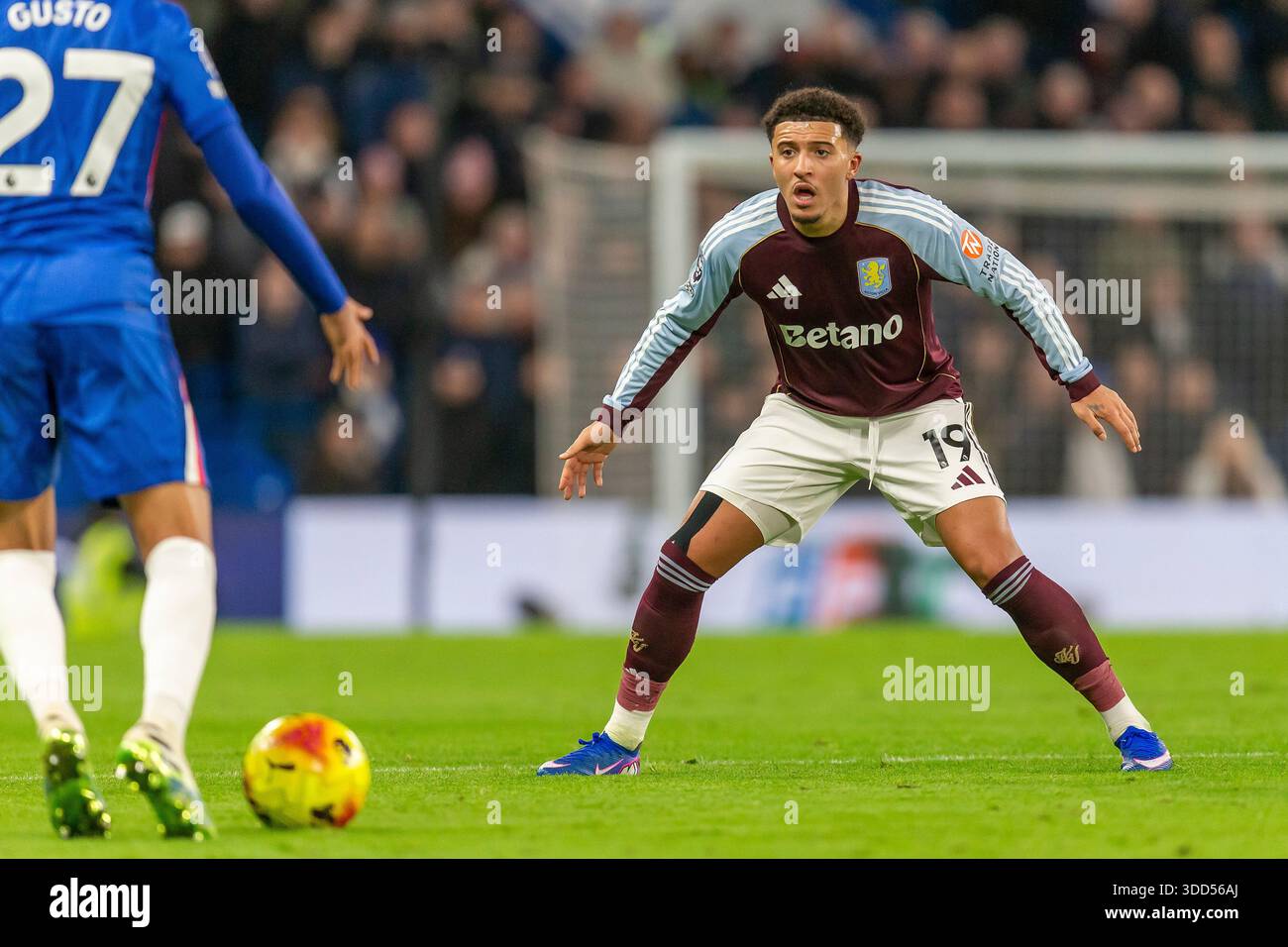 Jadon Sancho of Aston Villa pressures Malo Gusto of Chelsea during the ...