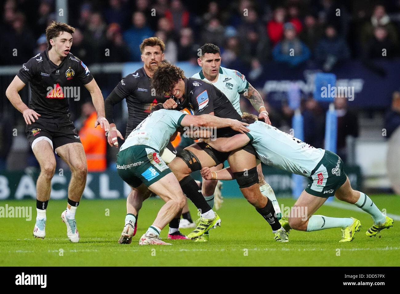 Exeter Chiefs' Andrea Zambonin is tackled by Leicester Tigers' Adam ...