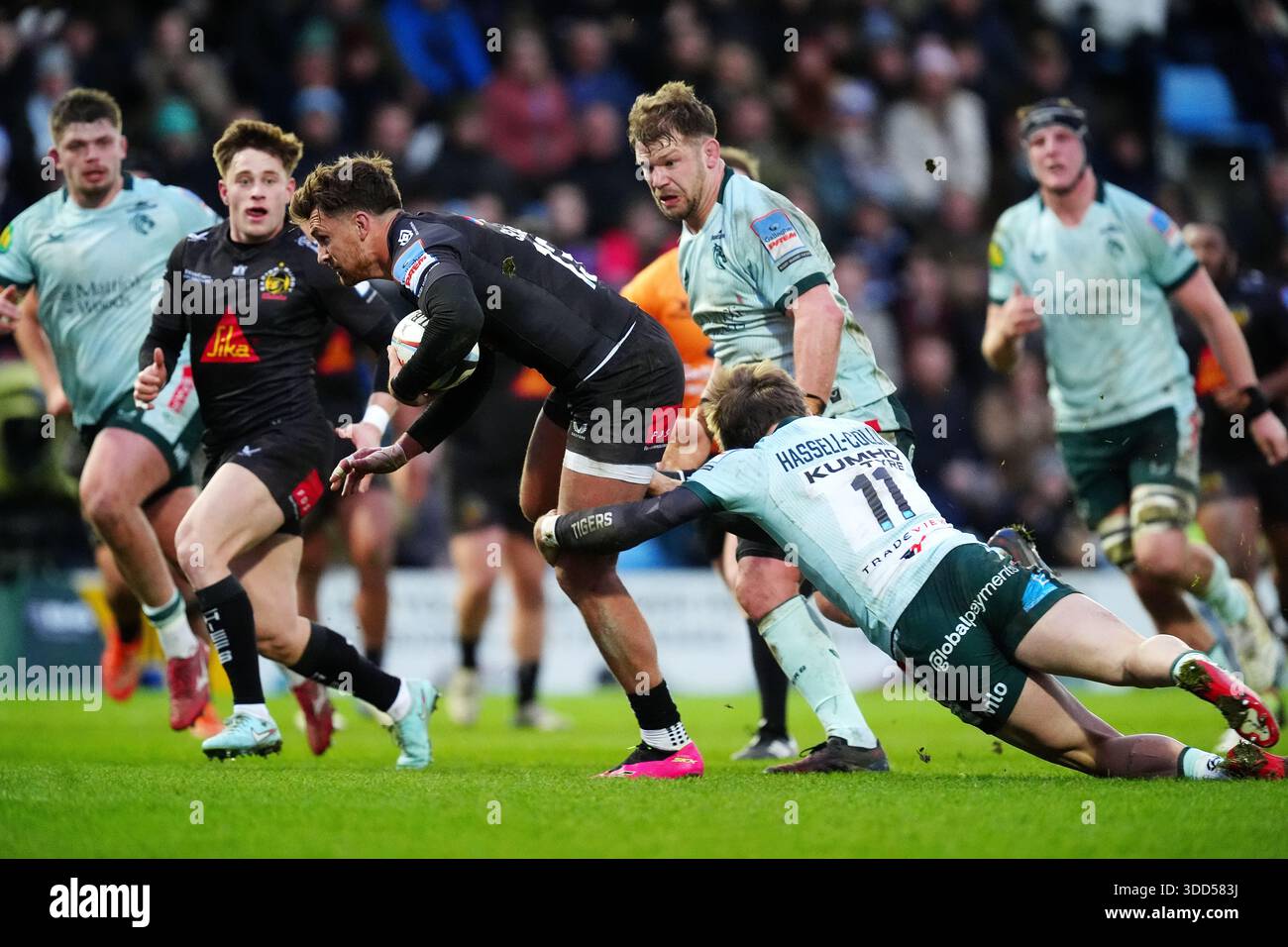 Exeter Chiefs' Campbell Ridl is tackled by Leicester Tigers' Ollie ...