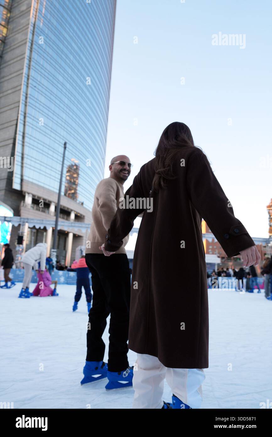 Milan, Crowds of people at the ice rink, taking selfies and admiring ...