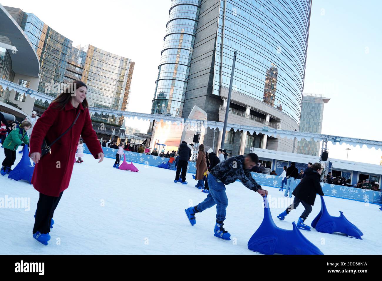 Milan, Crowds of people at the ice rink, taking selfies and admiring ...