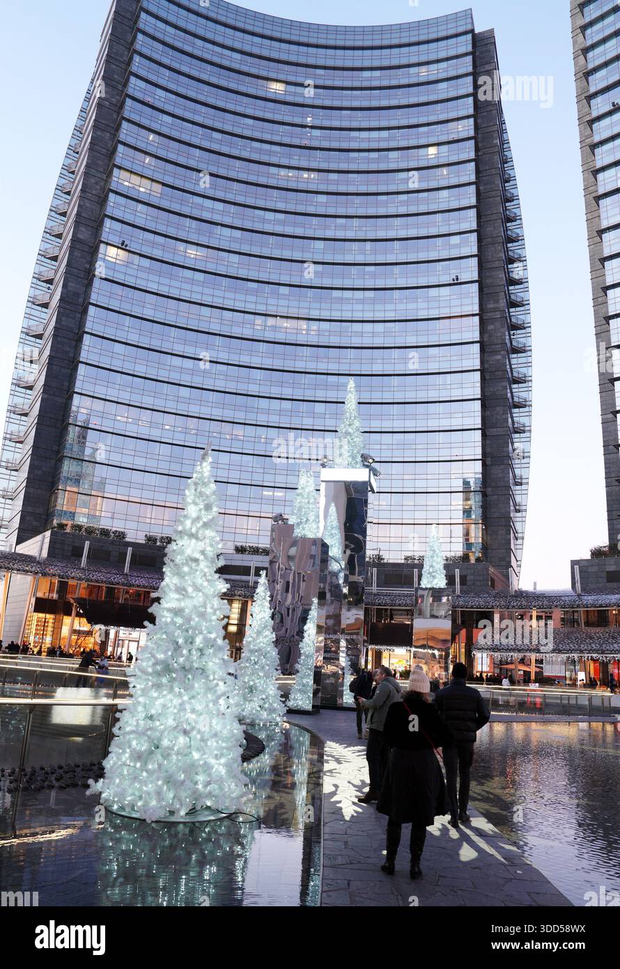 Milan, Crowds of people at the ice rink, taking selfies and admiring ...