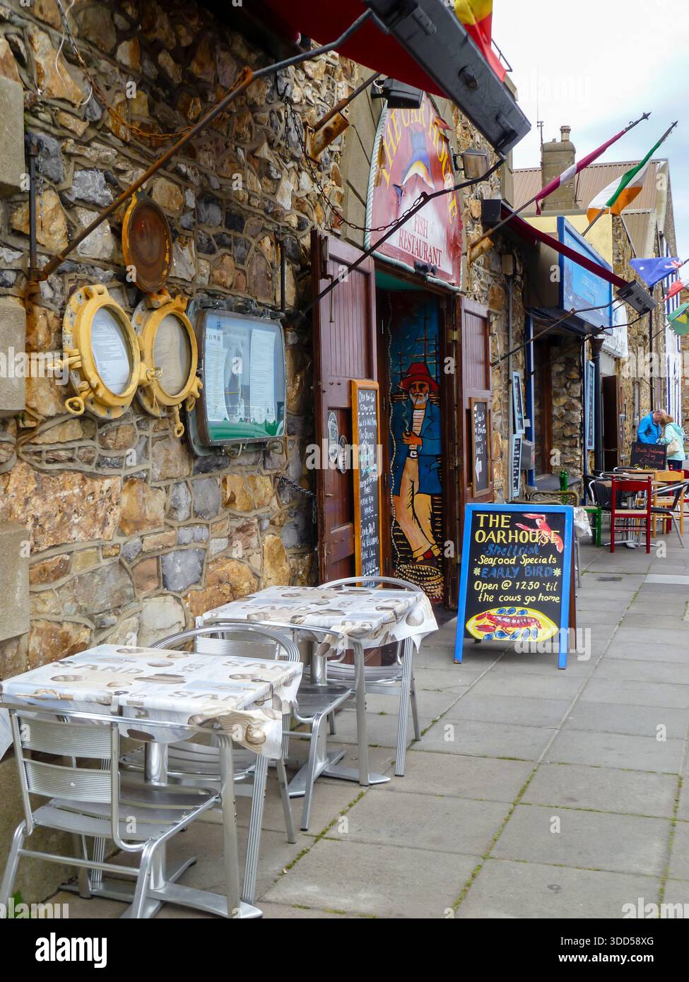 Tables outside the award winning Oarhouse seafood restaurant at Howth ...