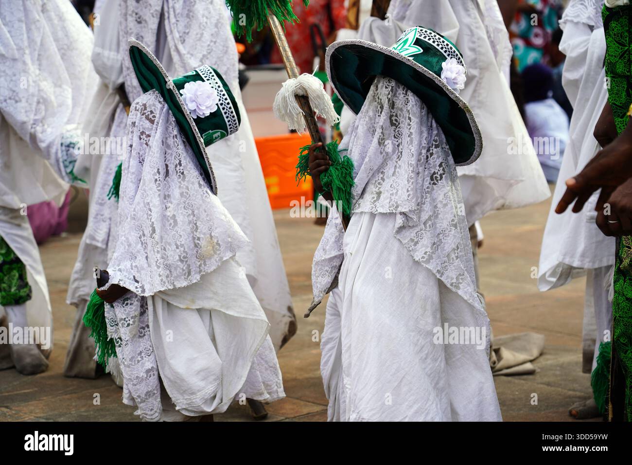 Eyos, or costumed dancers, participate in an event for the Eyo Festival ...