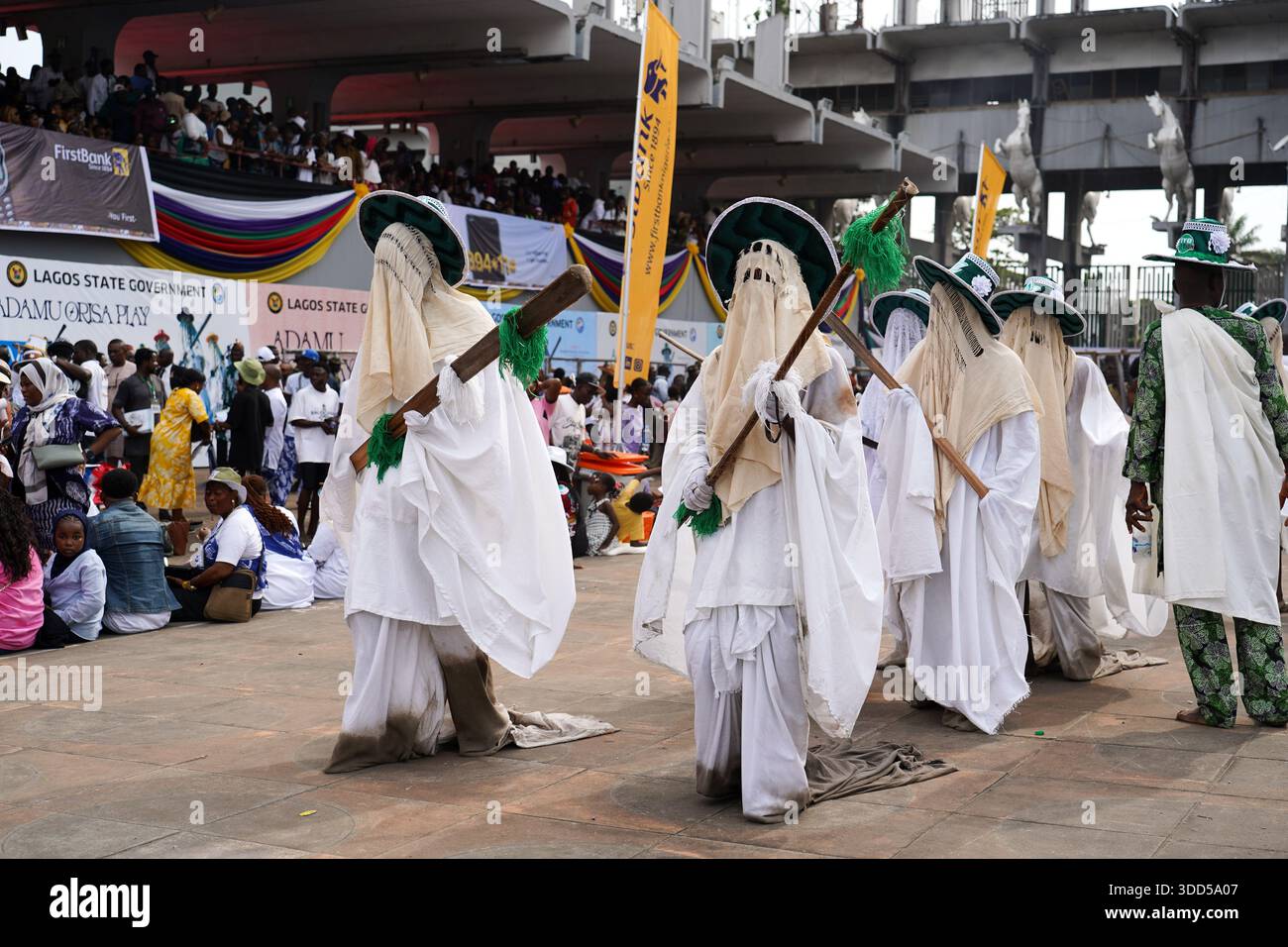 Eyos, or costumed dancers, participate in an event for the Eyo Festival ...