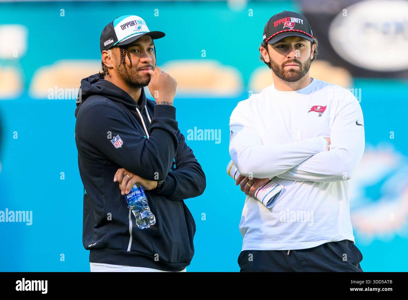 Miami Dolphins quarterback Tua Tagovailoa, left, and Tampa Buccaneers ...