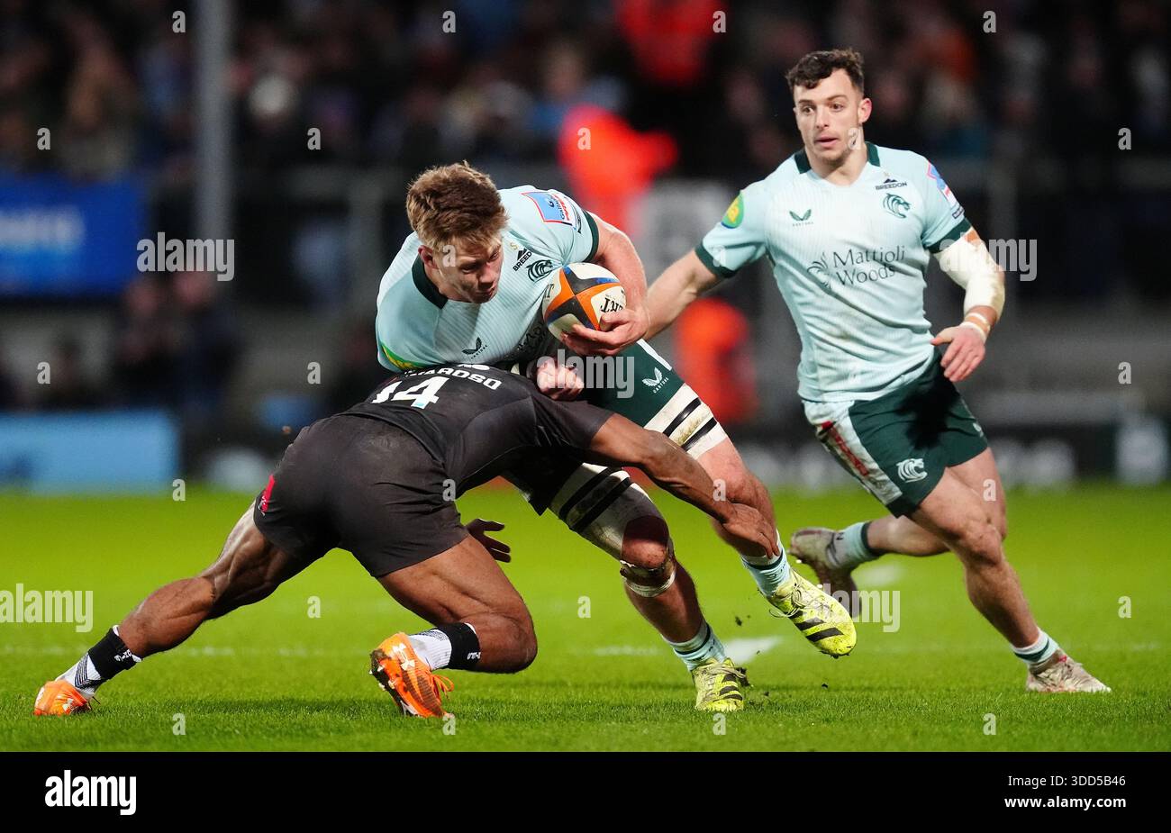 Leicester Tigers' James Thompson is tackled by Exeter Chiefs' Immanuel ...