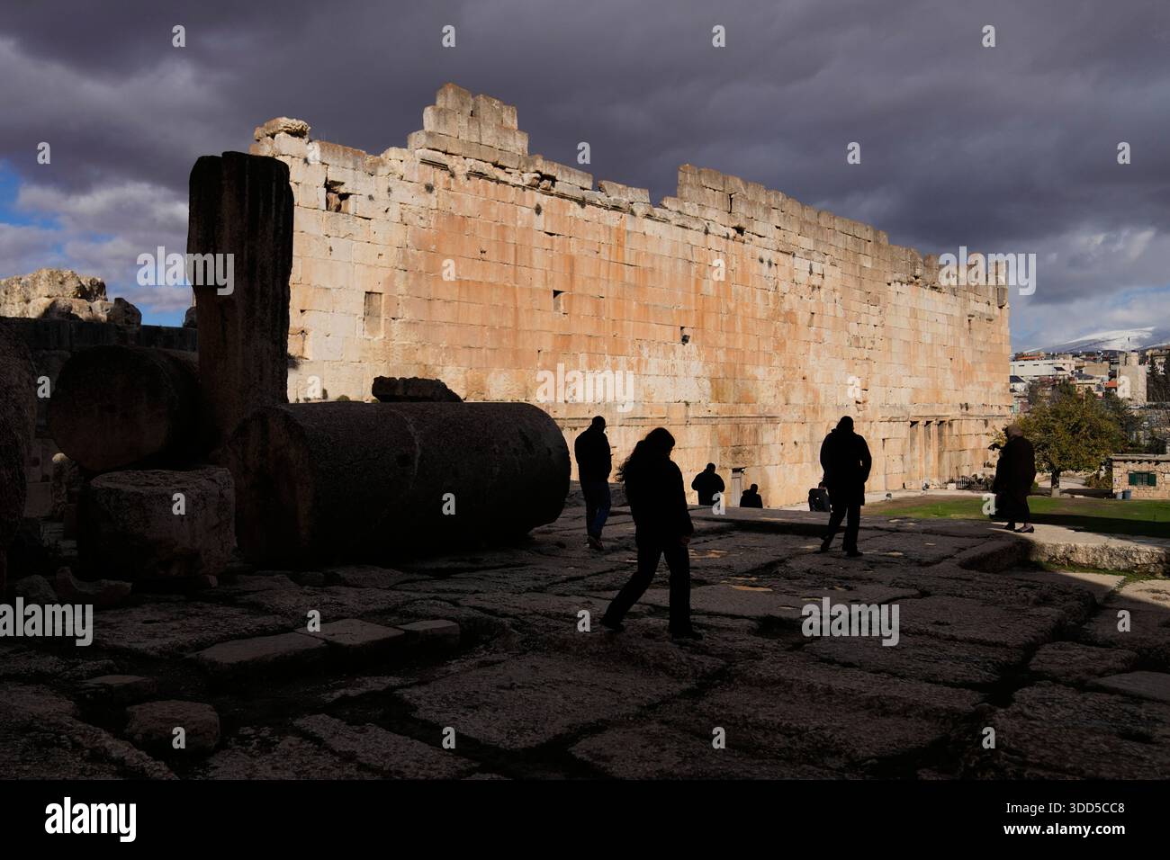 Visitors walk past fallen columns at the Roman acropolis in the ...