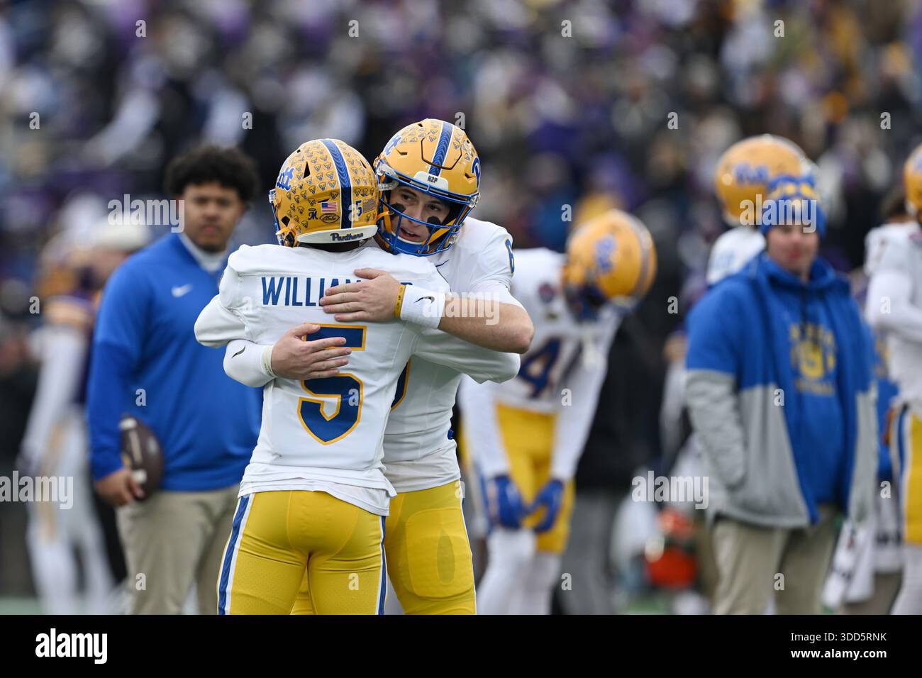 Pittsburgh quarterback Mason Heintschel (6) hugs Pittsburgh wide ...