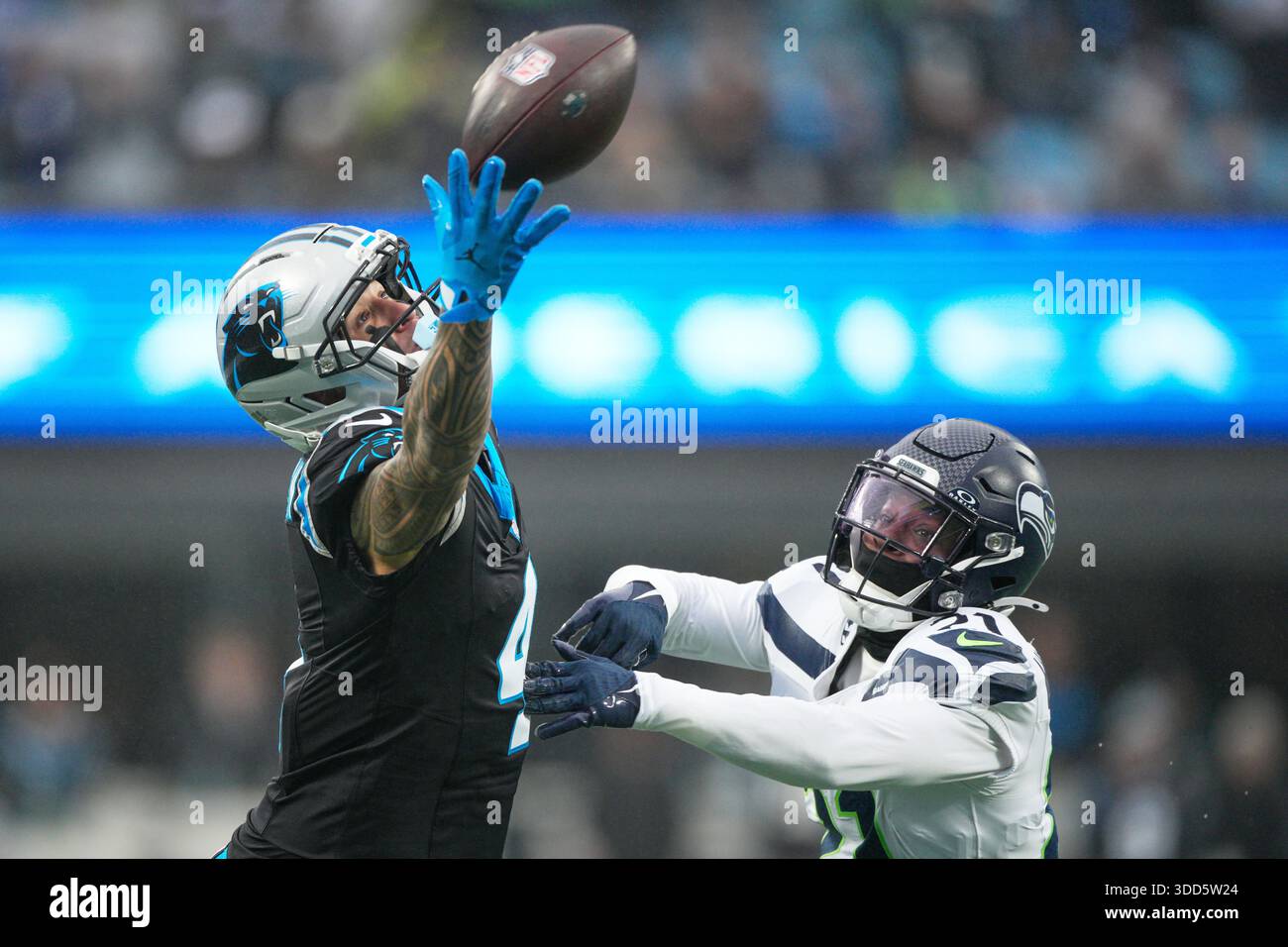Seattle Seahawks cornerback Devon Witherspoon breaks up a pass intended ...