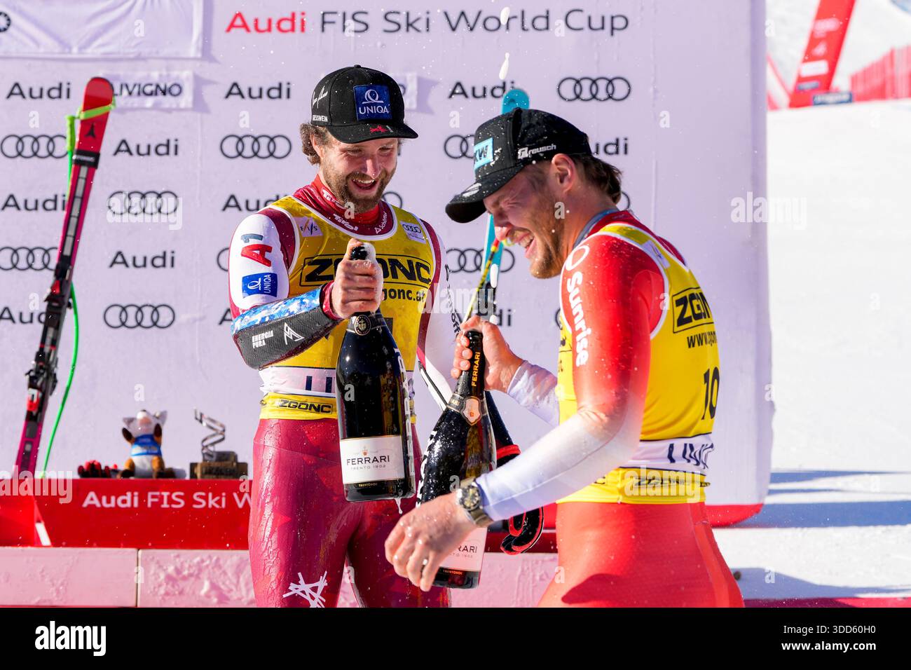 LIVIGNO, ITALY - DECEMBER 27: Marco Schwarz of Austria L) cheers with ...