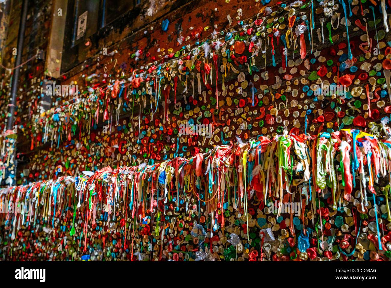 The famous Gum Wall is captured in a close-up view located in the ...