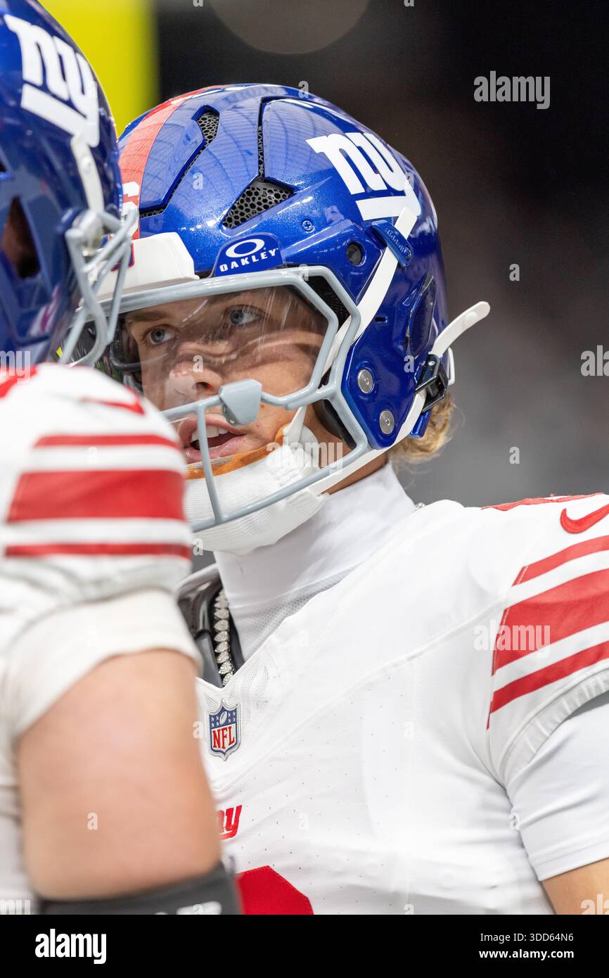 New York Giants quarterback Jaxon Dart (6) warms up before playing ...