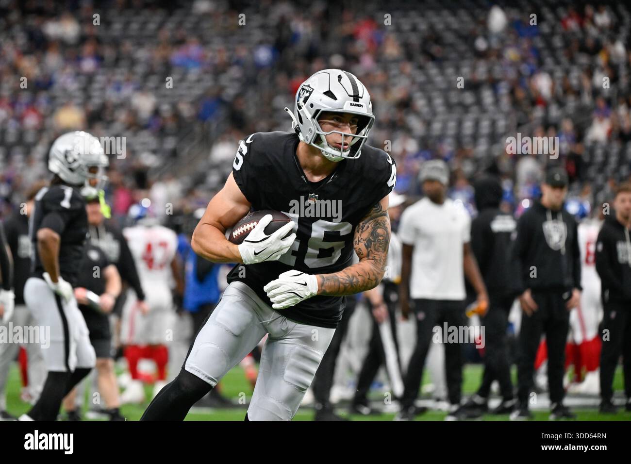 Las Vegas Raiders tight end Carter Runyon (46) warms up before the team ...