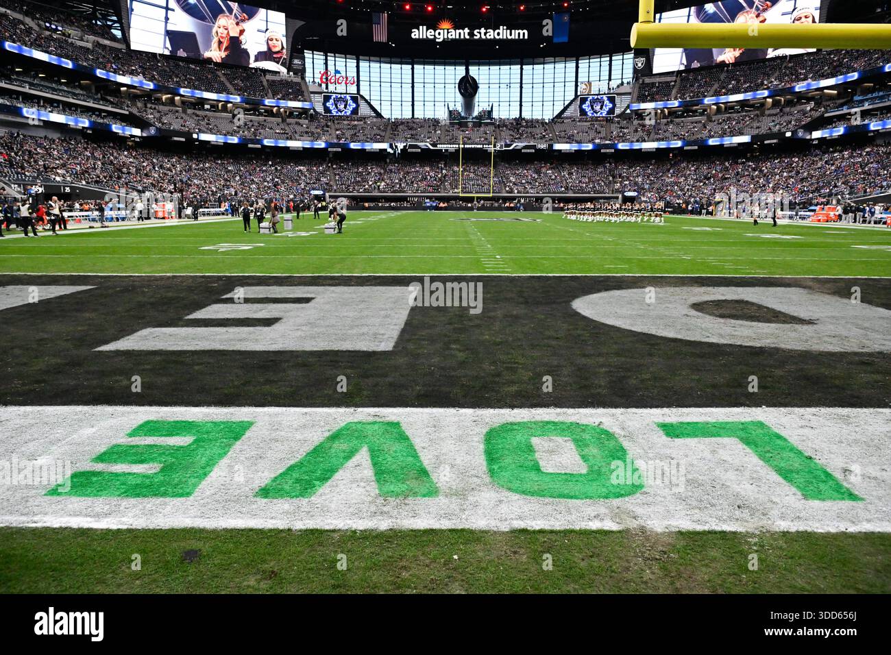 The word "LOVE" is painted on the field before an NFL football game ...