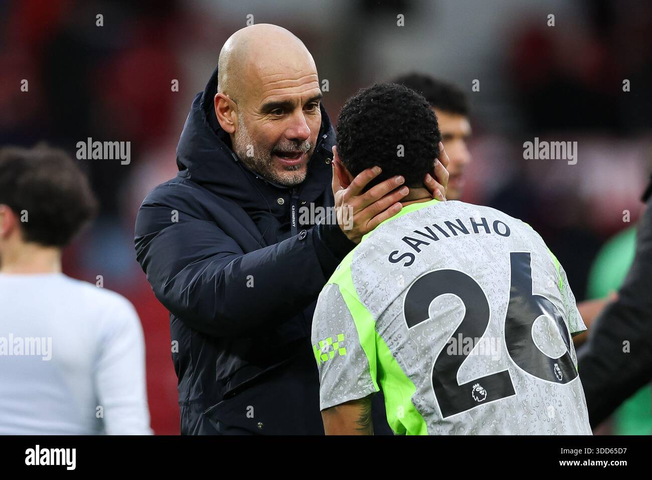 Manchester City manager Pep Guardiola and Manchester City's Savio after ...