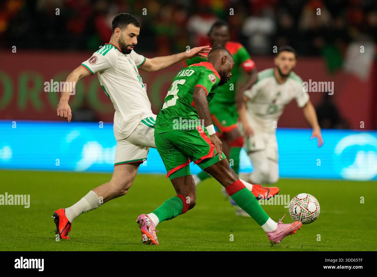 Algeria's Rafik Belghali challenges Burkina Faso's Steeve Yago during ...