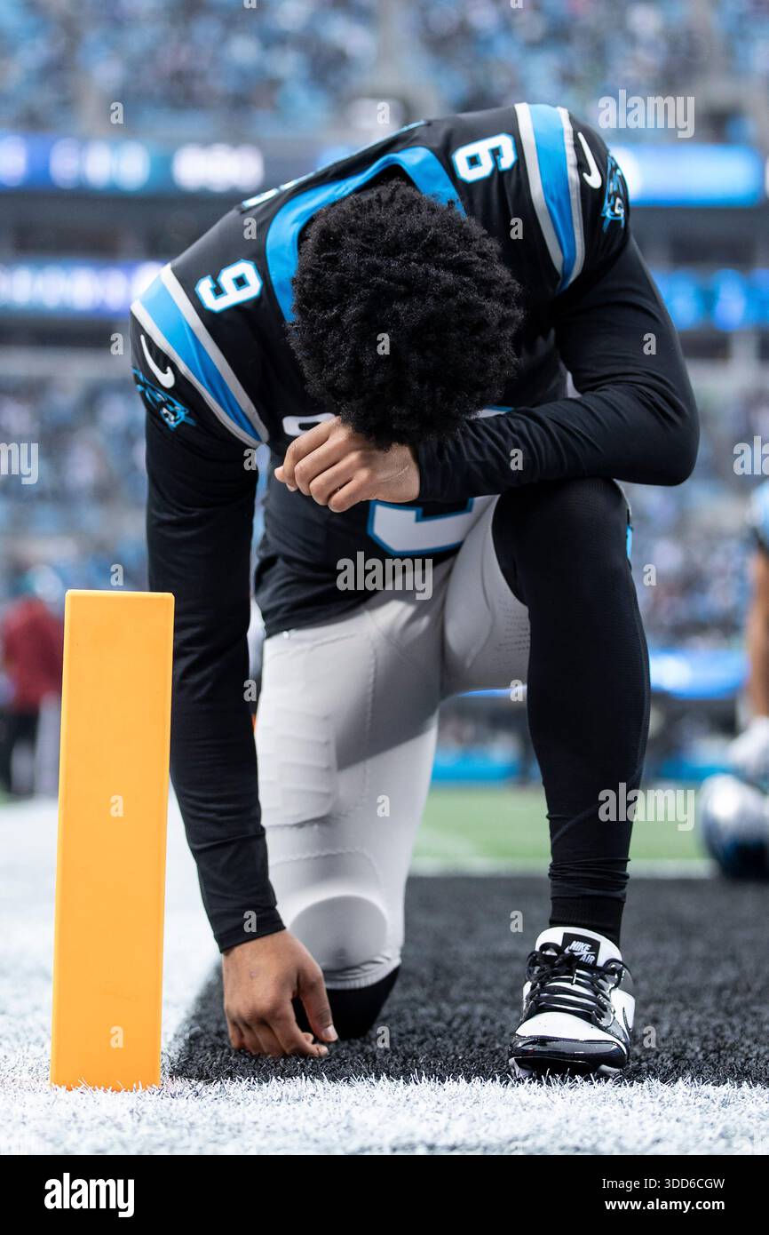 Carolina Panthers quarterback Bryce Young (9) kneels in the corner of ...