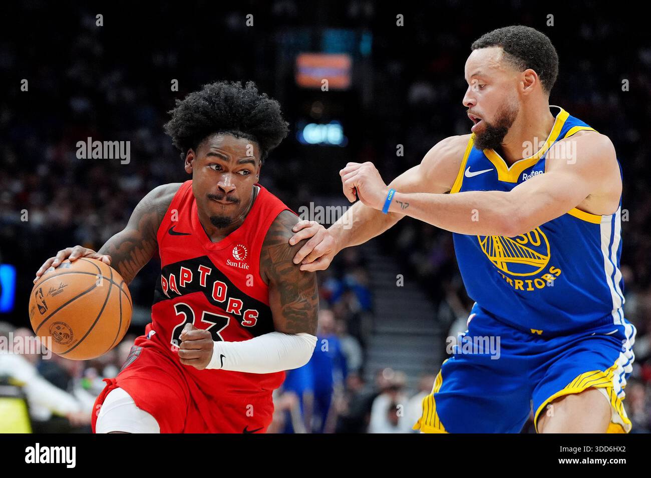 Toronto Raptors guard Jamal Shead, left, tries to drive past Golden ...