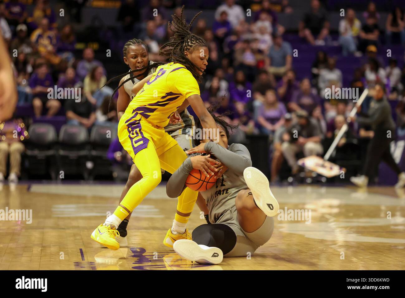 LSU guard Milaysia Fulwiley, front left, and Alabama State forward ...