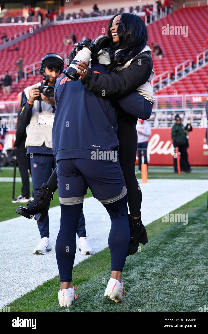 Simone Biles, top, hugs her husband, Chicago Bears defensive back ...