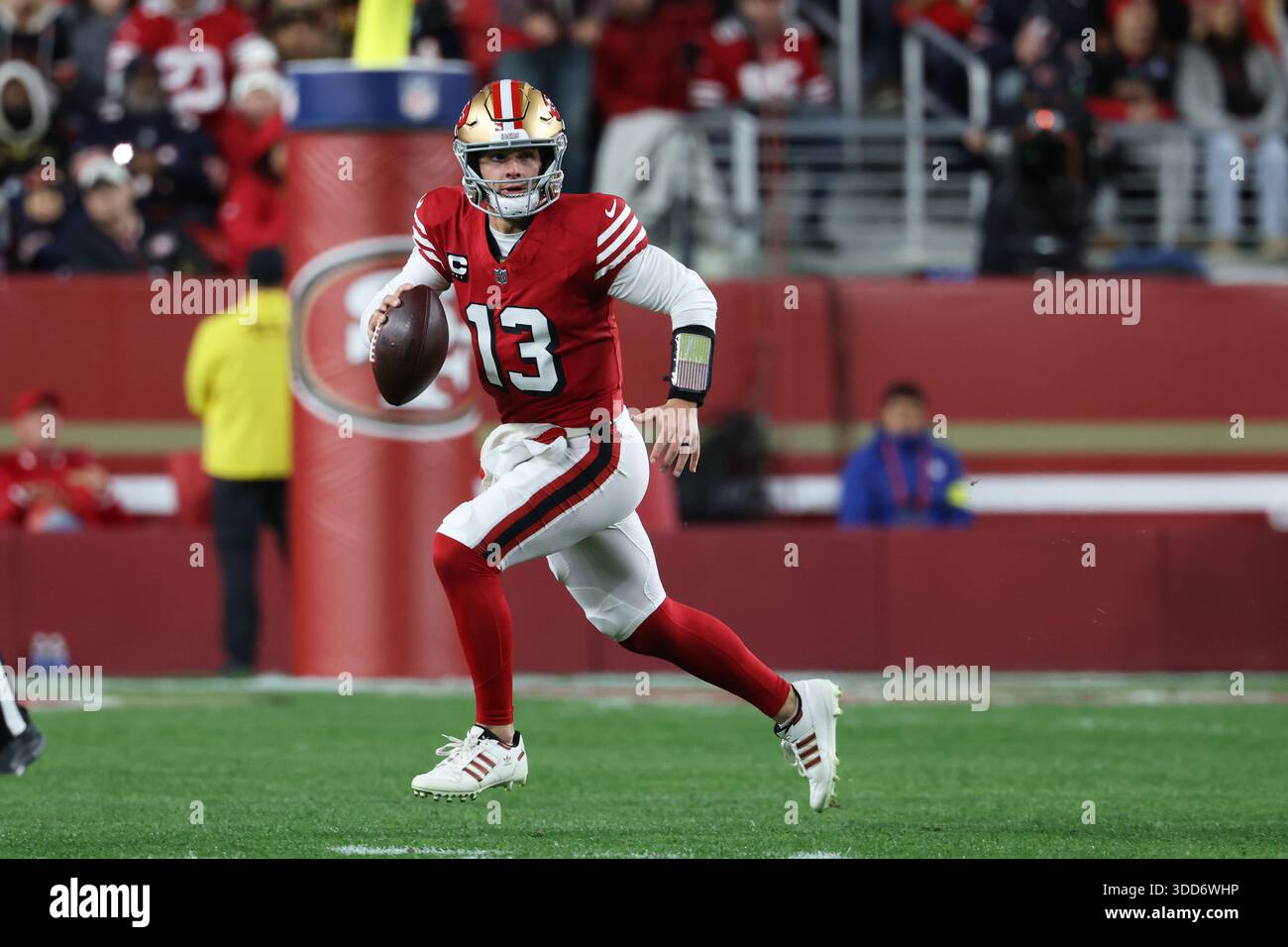 San Francisco 49ers quarterback Brock Purdy (13) rolls out against the ...