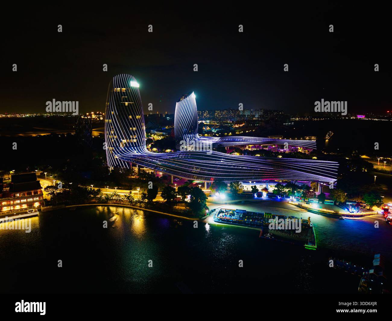 DANZHOU, CHINA - DECEMBER 16, 2025 - The night view of Hilton Hotel in ...