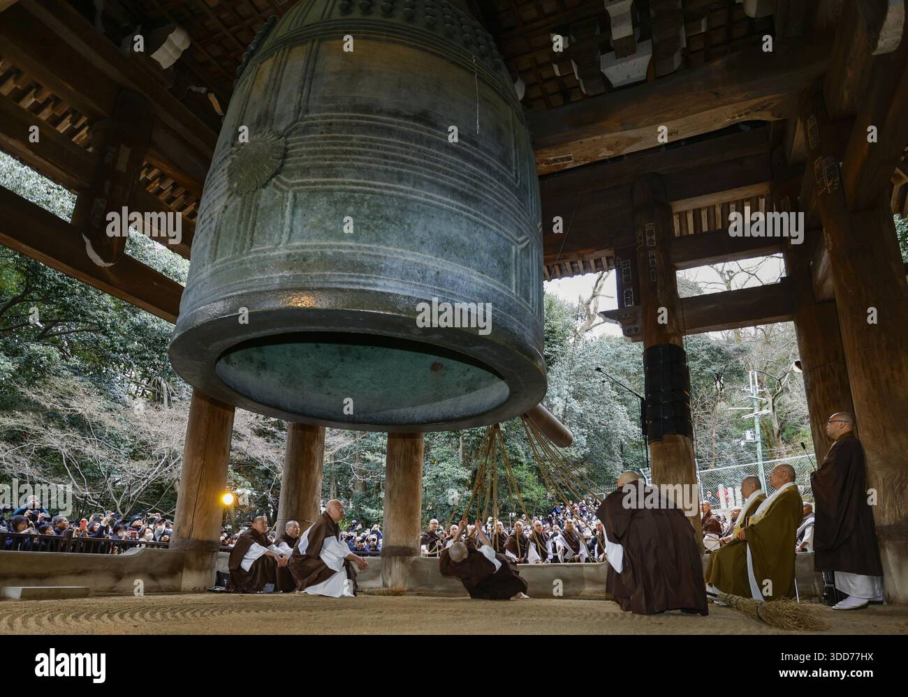 Monks ring a giant bell at Chion-in temple in Kyoto on Dec. 27, 2025 ...
