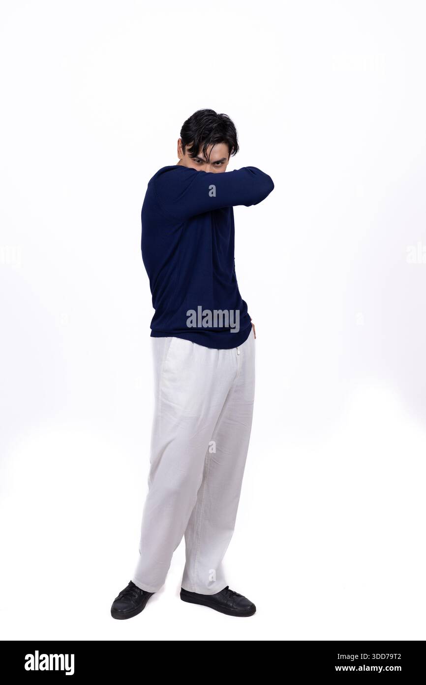 Man standing back to camera and doing dab gesture Stock Photo - Alamy