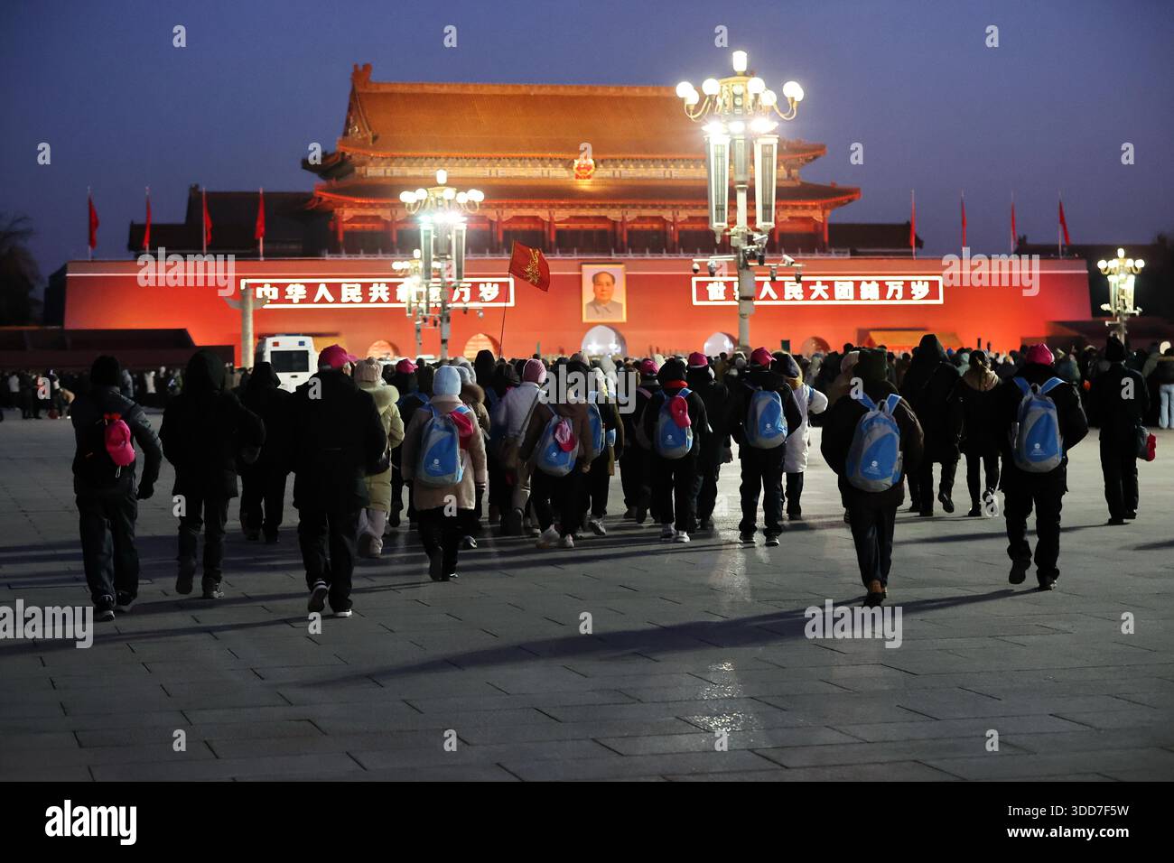 People attend the flag-raising ceremony at Tiananmen Square in Beijing ...