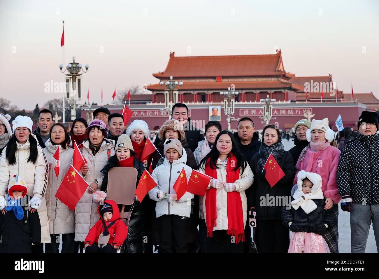 People attend the flag-raising ceremony at Tiananmen Square in Beijing ...