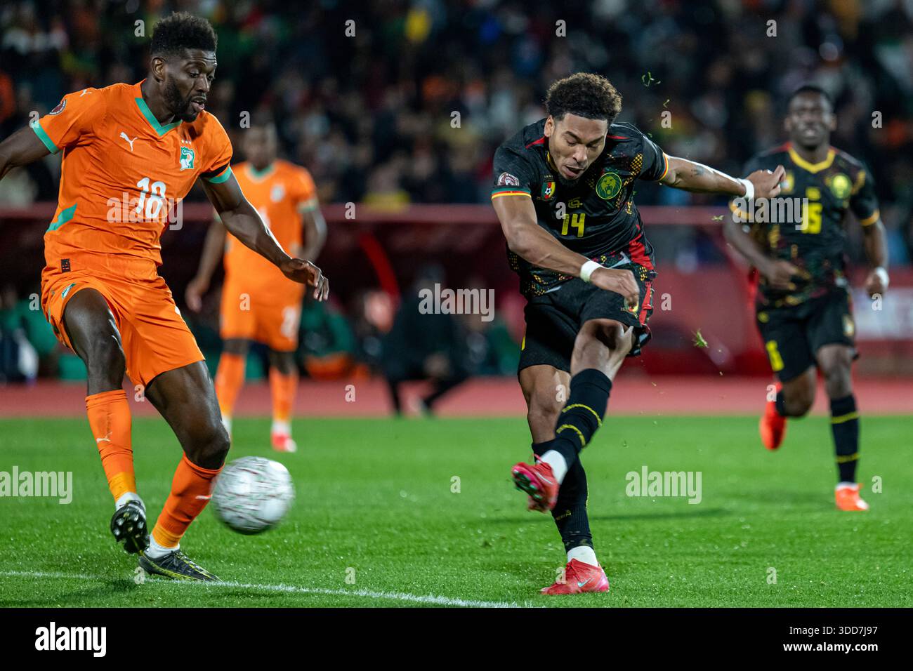 Danny Namaso of Cameroon shoots at goal hitting the crossbar during the ...