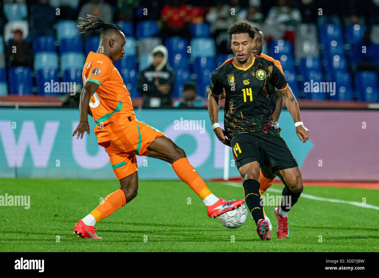 Yan Diomande of Côte d’Ivoire fights for the ball with Danny Namaso of ...