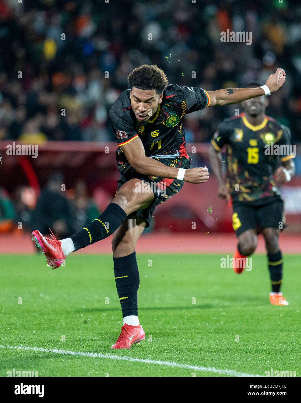 Danny Namaso of Cameroon shoots at goal hitting the crossbar during the ...
